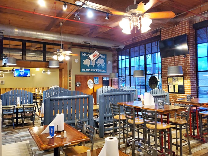 Warm wood, exposed brick, and blue dividers create distinct dining zones. It's like eating in your favorite uncle's renovated barn—if he could smoke meat like a pro.