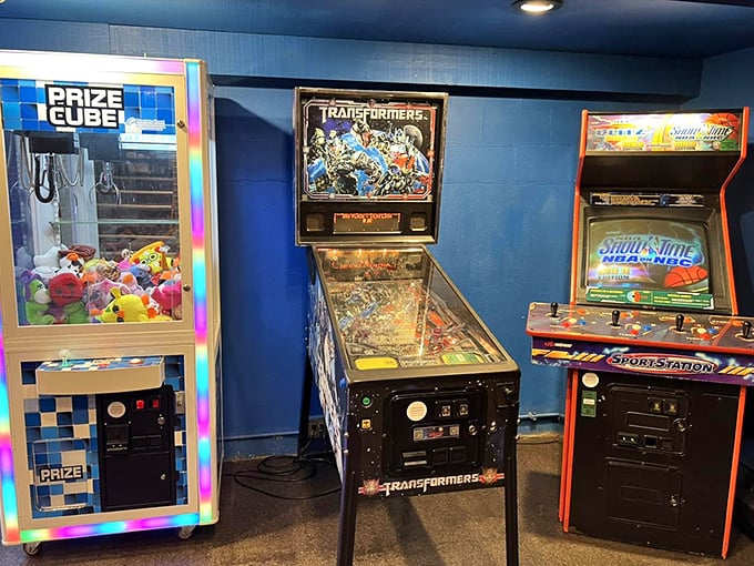 The arcade corner offers post-pizza entertainment – where parents relive their youth and kids discover the joy of actual buttons and joysticks.