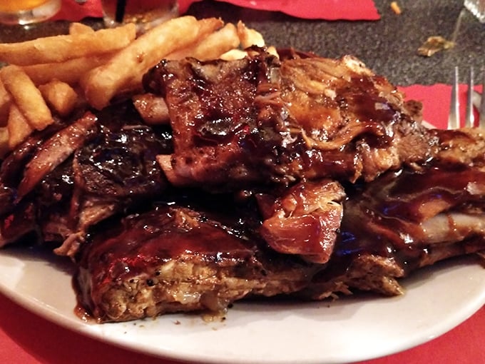 These BBQ ribs don't just fall off the bone—they practically leap onto your fork in a sticky, sweet surrender that's worth every napkin.