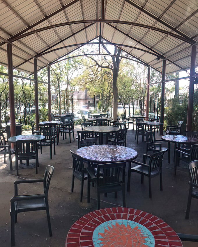 The patio dining area offers a breath of fresh air and mosaic tables that add a splash of color to your morning coffee ritual.