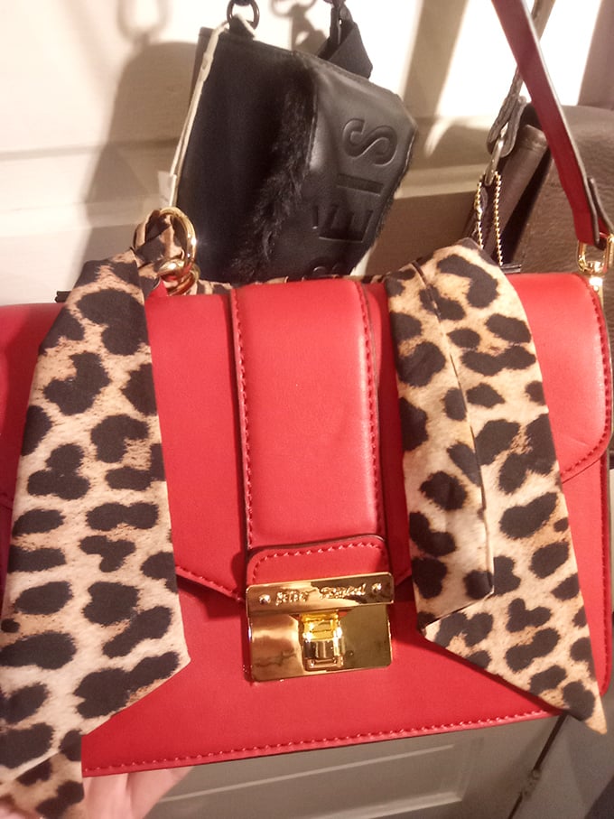 That red and leopard handbag screams "fashion risk-taker" with just enough "I know exactly what I'm doing" confidence.