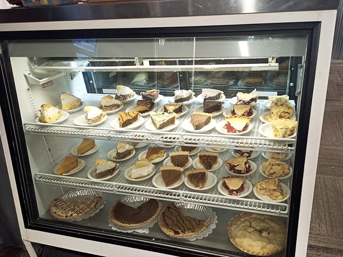 The dessert case – where willpower goes to die and "I'll just have a bite" becomes the lie we tell ourselves.