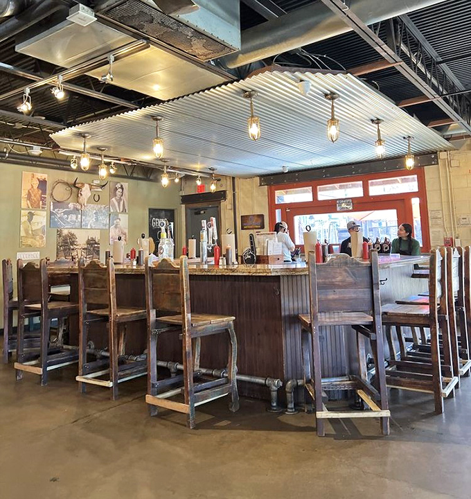 The bar area—where Texas craft beers flow freely and strangers swap stories about the best BBQ they've had until today.