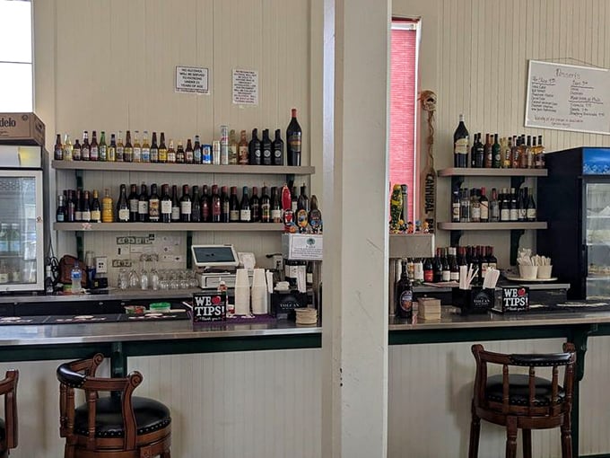 The bar at Phil's doesn't need fancy mixologists or trendy spirits – just honest pours to complement nature's perfect food.
