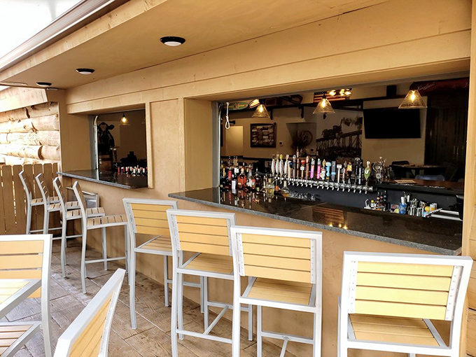 The bar area—where strangers become friends and friends become family over perfectly mixed cocktails and lively conversation.