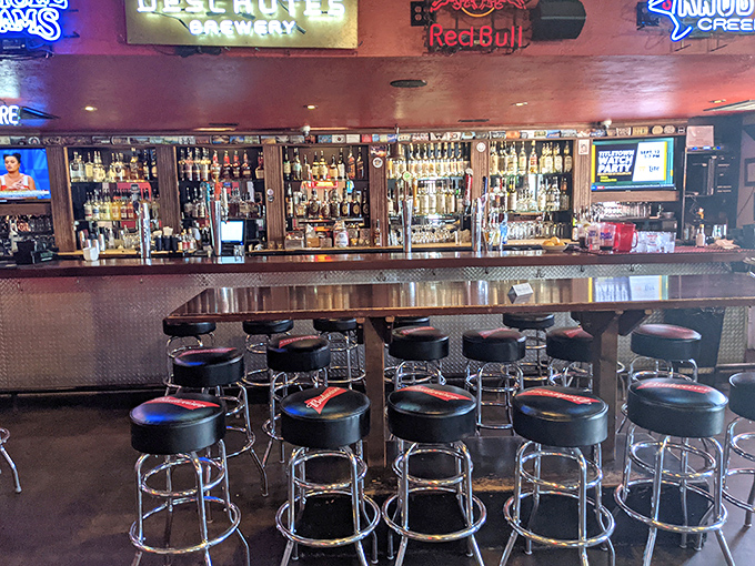 The bar at Lucky 13 – where strangers become friends and friends become regulars. Beer taps stand ready like soldiers awaiting orders.