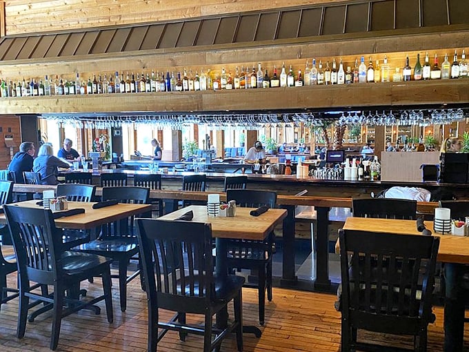 The well-stocked bar isn't just functional—it's a gallery of possibilities where vacation spirits meet professional craftsmanship.