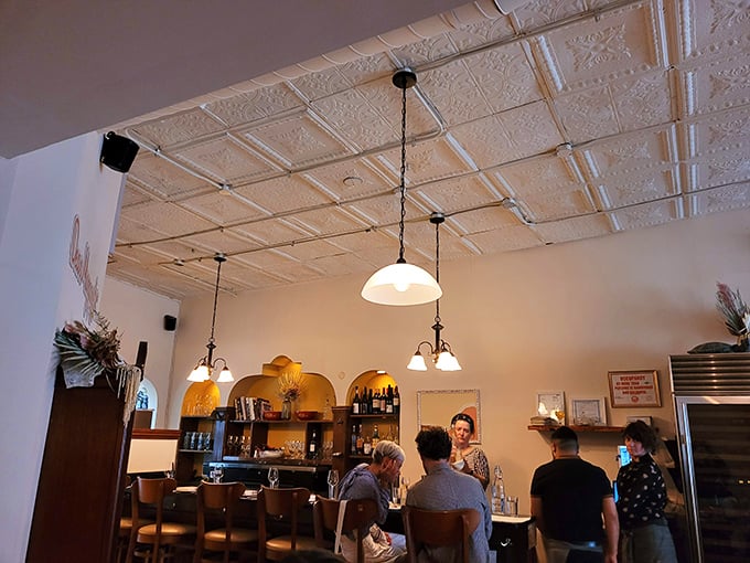 The cozy bar area with its warm lighting and pendant fixtures invites you to settle in for a pre-dinner drink or nightcap.
