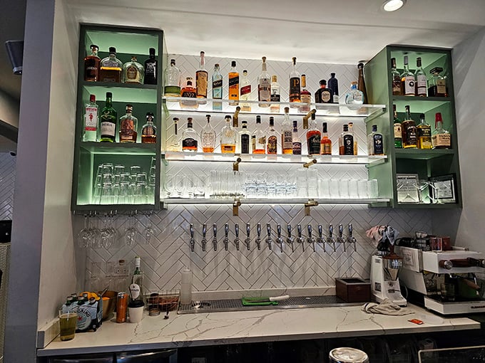 The bar setup isn't just functional—it's a shrine to the art of libation, with bottles arranged like treasures waiting to enhance your meal.