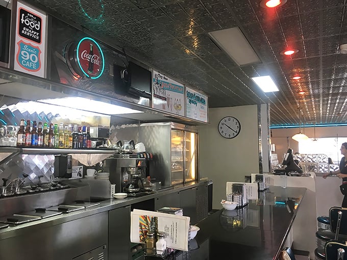 The kitchen's neon glow isn't just illumination—it's a beacon calling hungry travelers to the promised land of home cooking.