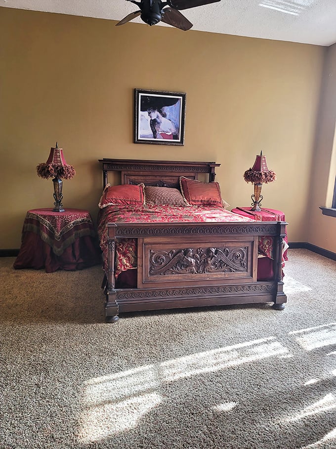 This ornate bedroom with its carved wooden bed frame and rich fabrics proves that even in the 1900s, castle-dwellers knew the importance of thread count.