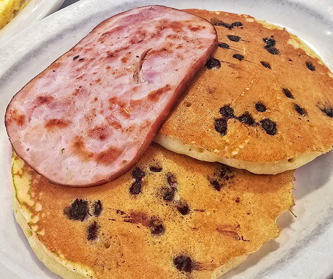 Blueberry pancakes with a side of ham—breakfast's perfect marriage of sweet and savory that makes getting out of bed completely worth the effort.