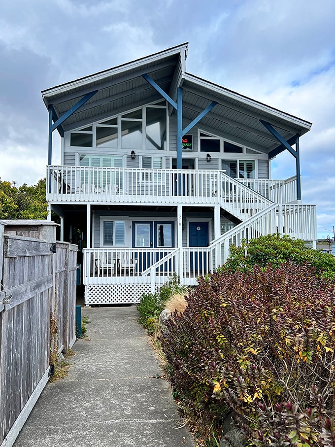 This coastal cottage exemplifies Bandon's architectural charm – blue accents echoing the ocean and a welcoming porch promising spectacular views.