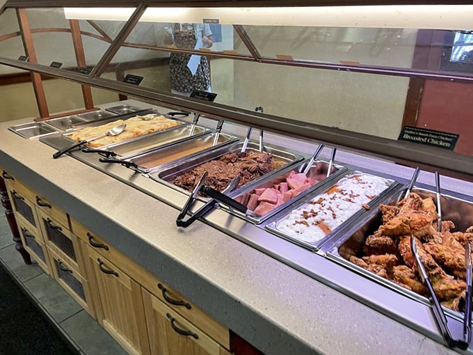 The buffet line—where dreams are made and diets go to die. Each steam tray promises a different journey into Amish culinary tradition.