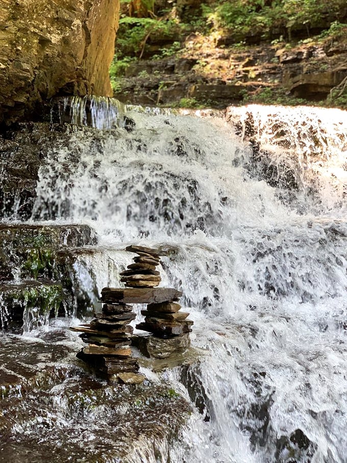 Stone stacked in perfect balance against rushing water—a meditation in motion that Instagram filters couldn't possibly improve upon.