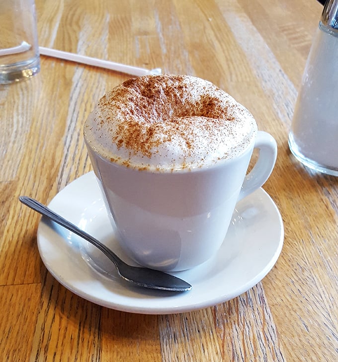 A cappuccino dusted with cinnamon that doesn't just wake you up—it gives you a reason to be awake.