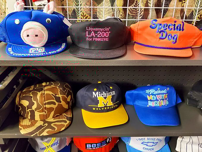 Hat heaven for the nostalgic soul – from blue pig mascots to Michigan Wolverines pride, each cap tells a story of loyalty, humor, or pharmaceutical promotion.