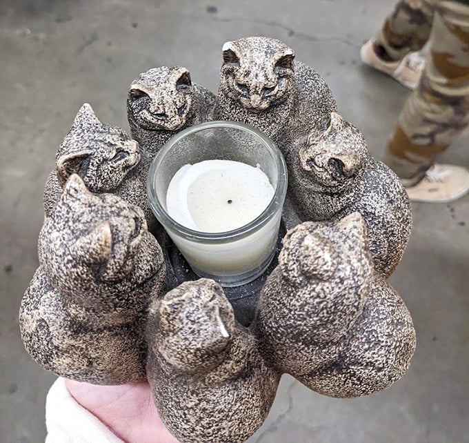 This circle of stone cats guarding a candle might be the most perfectly weird thrift store find—simultaneously creepy and irresistible.