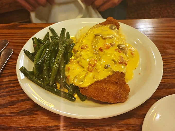 Chicken Cordon Bleu swimming in cheese sauce that would make a Frenchman weep and a cowboy tip his hat in respect.