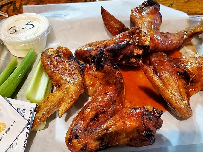 These wings aren't messing around—they've been through fire and emerged victorious. The celery sticks are just there to make you feel virtuous.
