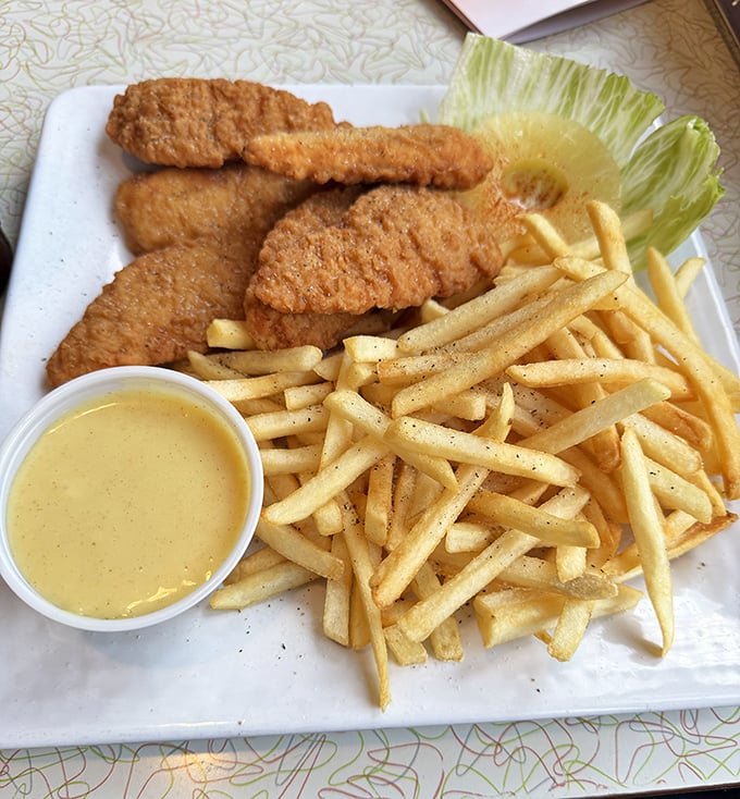 Golden chicken tenders and perfectly crisp fries – comfort food that speaks the universal language of "everything's gonna be alright."