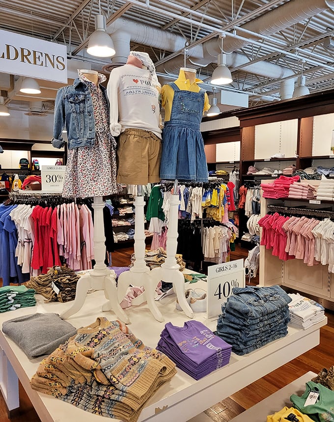 Children's clothing displays that make you spend three times more on kids' outfits than your own. That 40% off sign is retail's version of a siren song for grandparents with no impulse control.