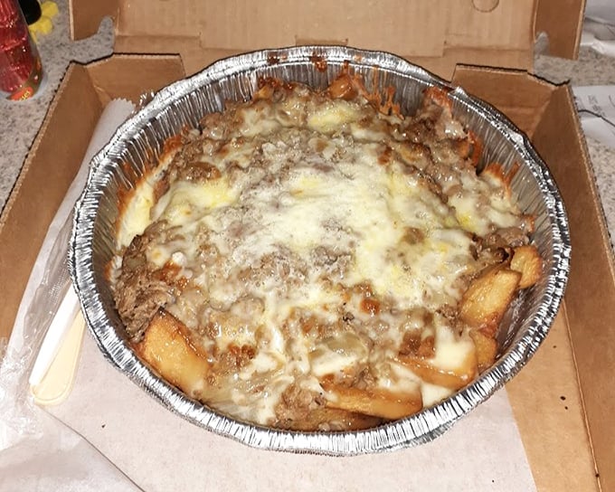 Chili cheese fries – where potatoes fulfill their destiny by becoming a molten landscape of meaty, cheesy magnificence.