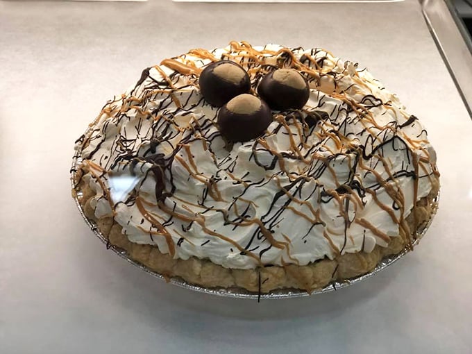 This isn't just pie – it's a cloud of whipped cream artistry topped with chocolate-dipped treasures that would make Grandma both proud and jealous.