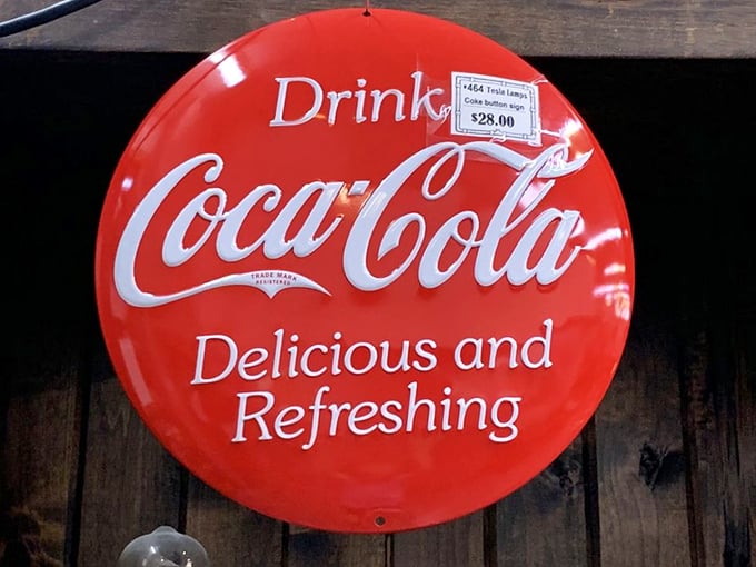 This vintage Coca-Cola button sign would make Don Draper swoon—advertising memorabilia that transforms walls from boring to brilliant.