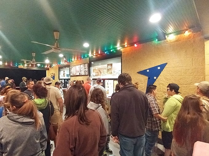 Intermission brings a rush to the concession stand, where strangers become temporary neighbors united by a shared craving for movie snacks.