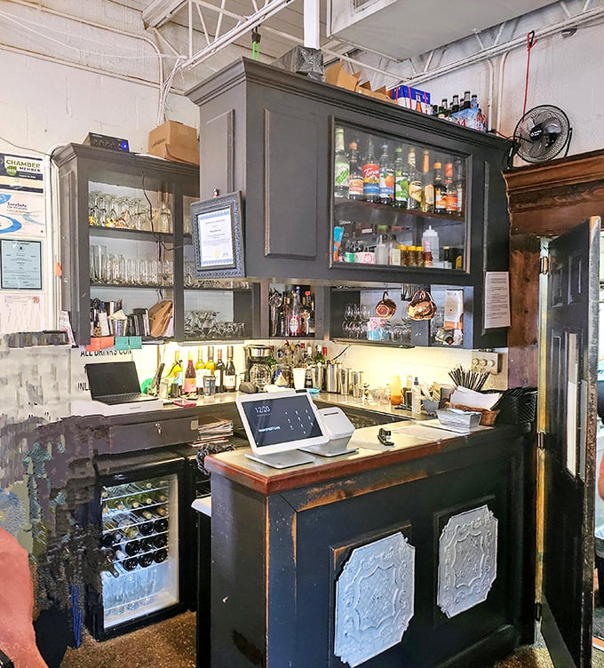The bar area speaks to Main Street Café's dual identity – part elegant dining establishment, part neighborhood watering hole where everybody knows your name.