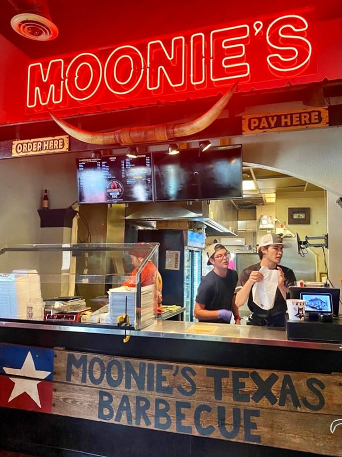 The longhorn above the counter isn't just decoration – it's a guardian spirit watching over the sacred exchange of money for meat.