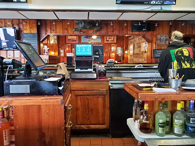 Behind this counter, seafood magic happens with choreographed efficiency—the command center of crab perfection that's been operating for generations.