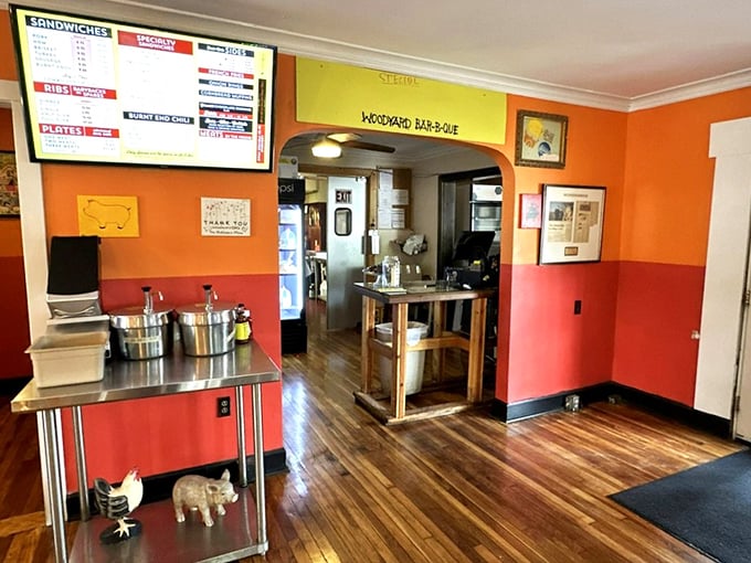 The orange and red walls aren't just decorative—they're preparing your eyes for the fiery delights about to grace your taste buds.