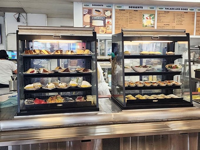 The dessert case – where willpower goes to die and "I'll just have a bite" becomes the lie we tell ourselves.