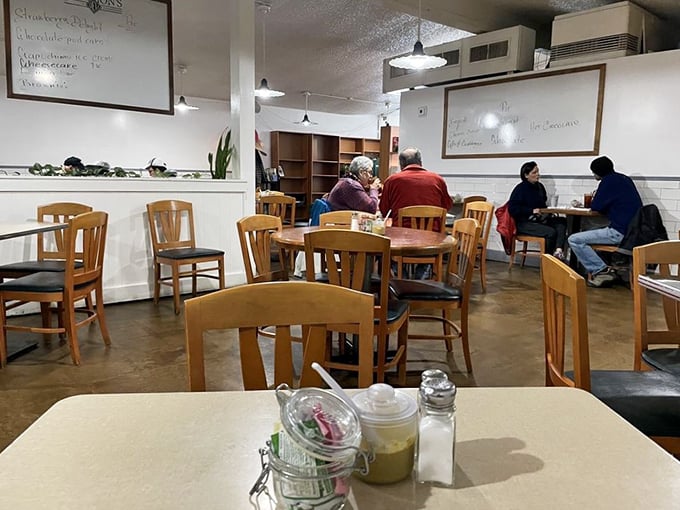 A quiet moment captured in the dining room—where strangers become neighbors over shared appreciation of proper deli fare.