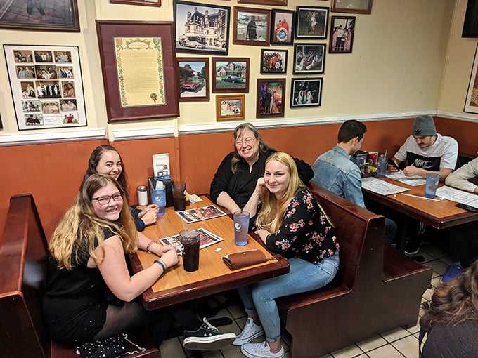Happy diners creating new memories in a place where barbecue brings strangers together and turns them into friends.
