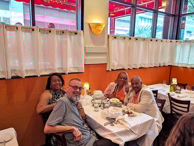 The dining room buzzes with the kind of energy that makes you feel like you've crashed a family reunion—in the best possible way.