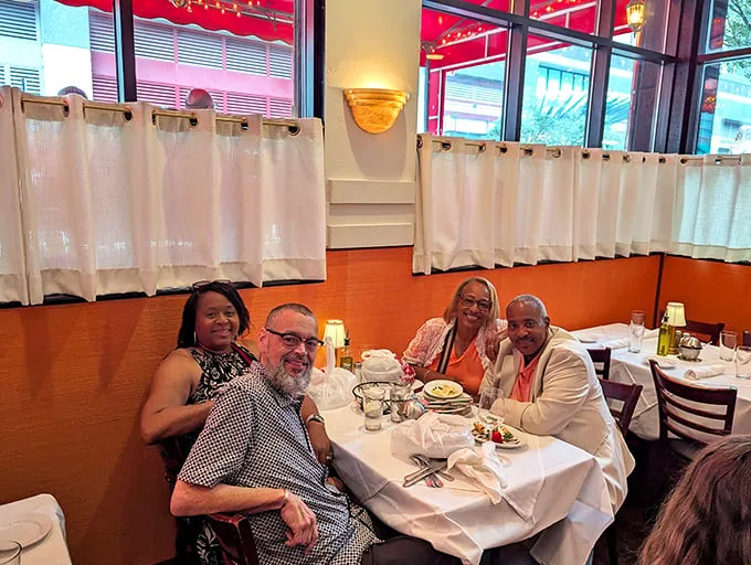 The dining room buzzes with the kind of energy that makes you feel like you've crashed a family reunion—in the best possible way.