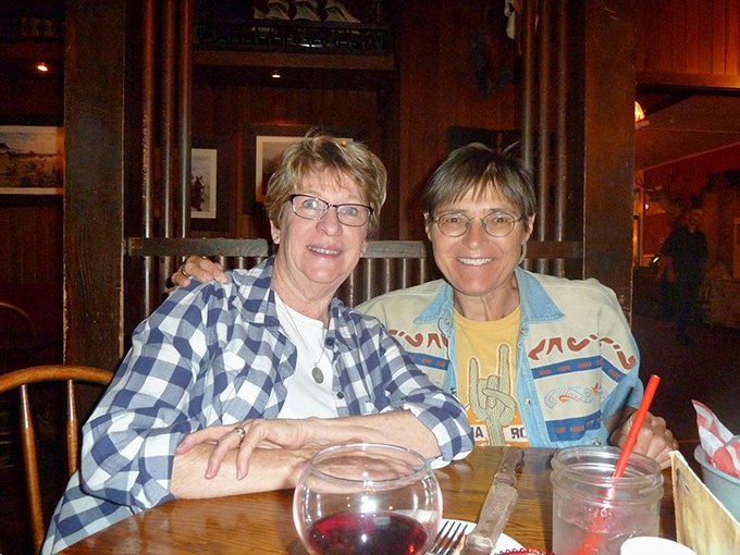 Happy diners sharing stories over good food and better company. Those glasses of wine aren't just beverages—they're conversation lubricants.