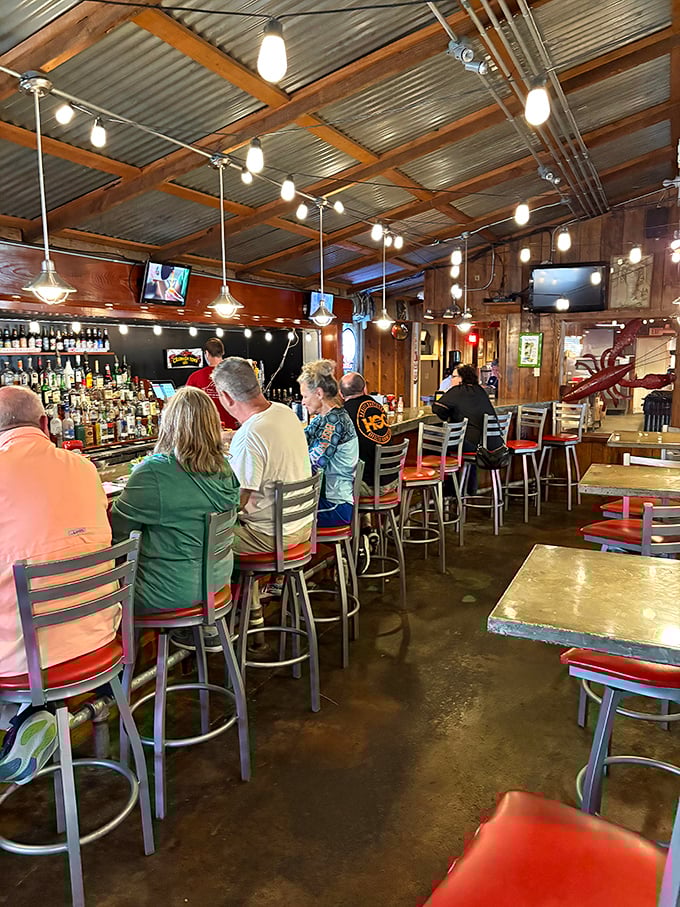 The bar area—where strangers become friends over cold beers and hot debates about who makes the best roux in Louisiana.