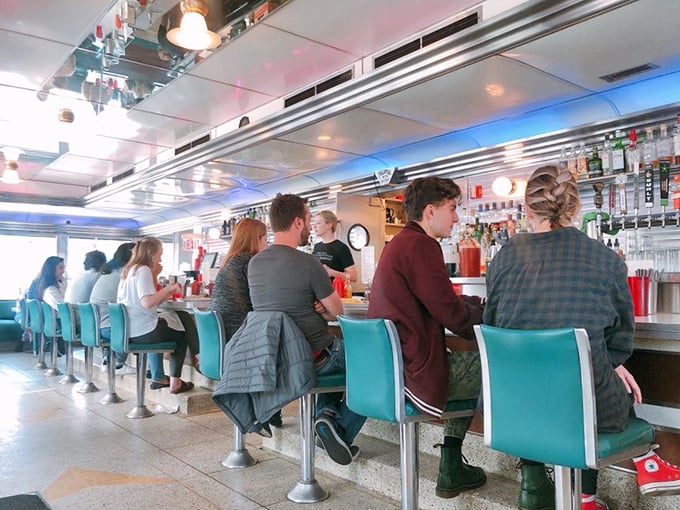The counter culture is alive and well at Hi-Lo. These diners know the secret: the best seats in the house are the blue swivel ones.