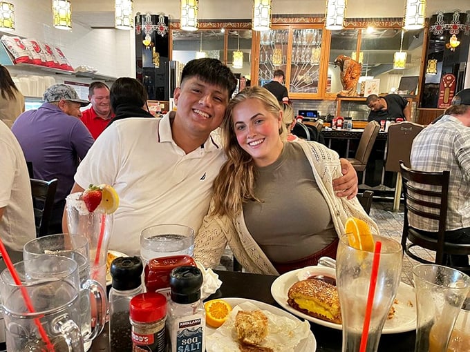 Happy diners sharing a moment of breakfast bliss. Their expressions say what words can't—this place delivers on its promises.
