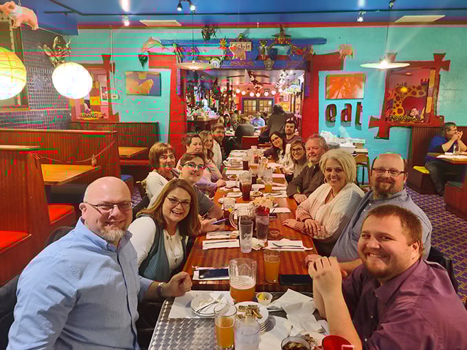 A gathering of the Cuz's faithful—notice how everyone's smiling? That's what happens before the food coma sets in.