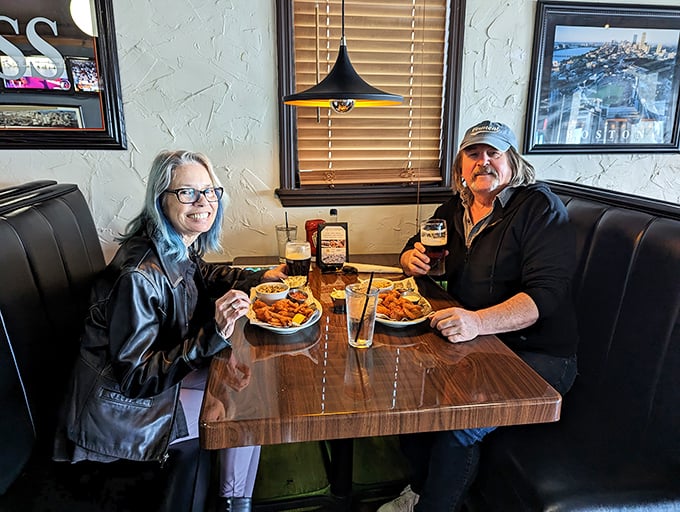Happy diners diving into their seafood feast – their expressions confirming that sometimes the best souvenirs are culinary memories.