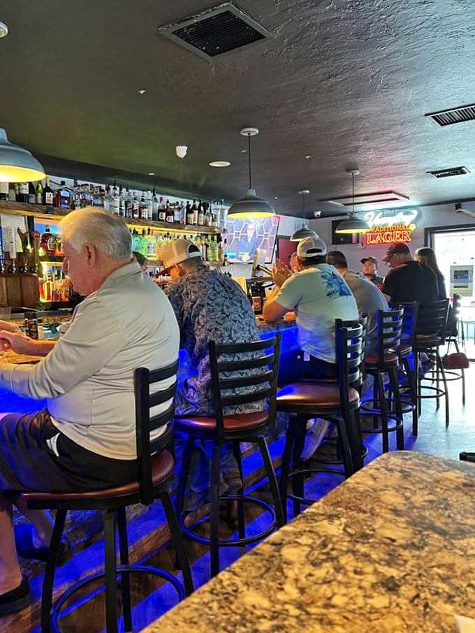 The bar fills with locals who've made this their second living room – the kind of authentic scene you won't find in any travel brochure.