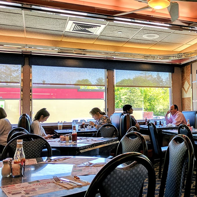 Where strangers become neighbors and neighbors become friends—the dining room hums with conversation and the gentle clink of silverware.