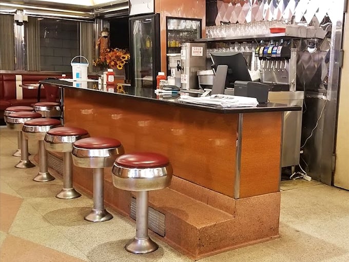 Where the magic happens—the counter where orders are called in diner shorthand and coffee cups never reach empty.