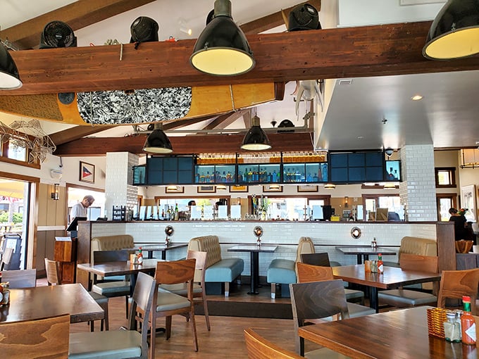Wooden beams, nautical decor, and tables positioned for maximum view-gazing—this dining room knows exactly what it's doing.