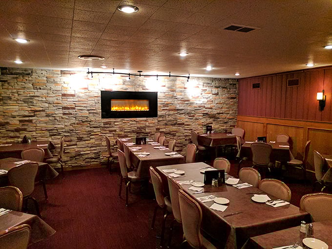 Stone walls, warm lighting, and a fireplace that says "stay awhile." This dining room isn't just a space—it's a sanctuary for serious eating.